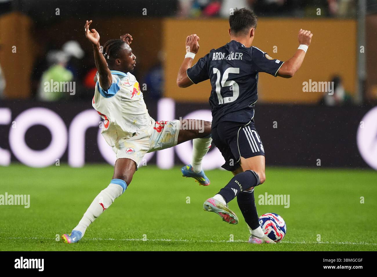 Red Bull Salzburg's Dorgeles Nene, left, and Real Madrid's Arda Guler ...