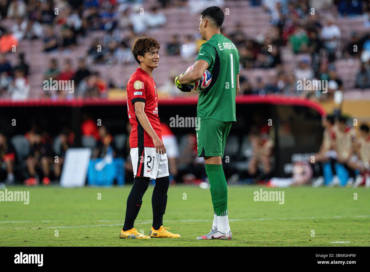 Urawa Red Diamonds midfielder Tomoaki Okubo (21) speaks with Monterrey ...