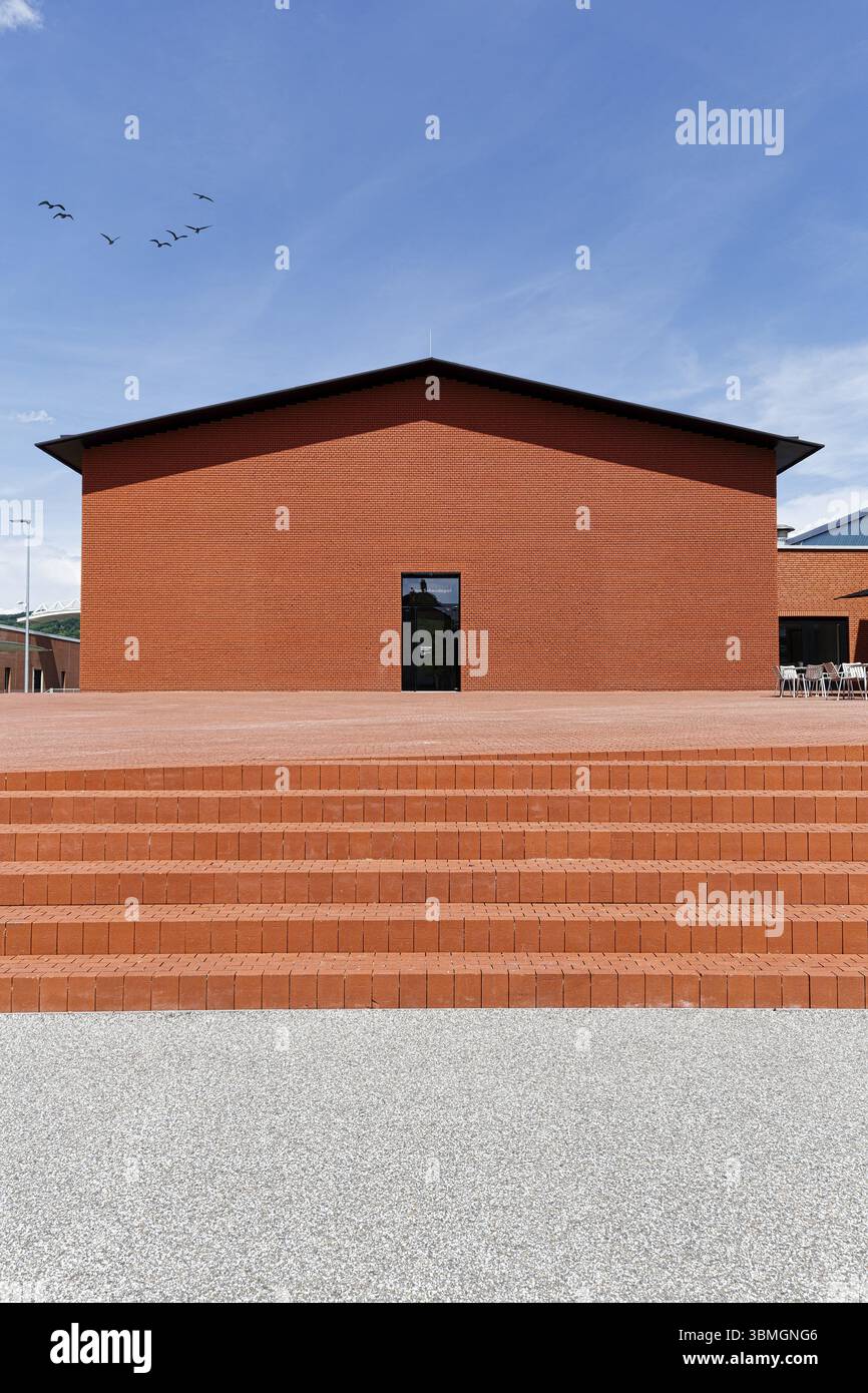 Windowless building made of red bricks in the form of a warehouse ...