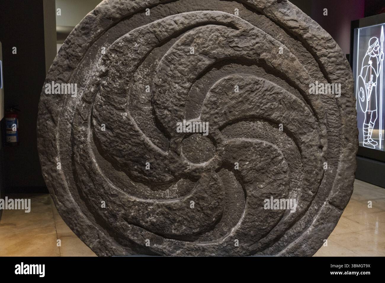 Five-armed swastika in relief, second Lombera stele, giant disc-shaped ...