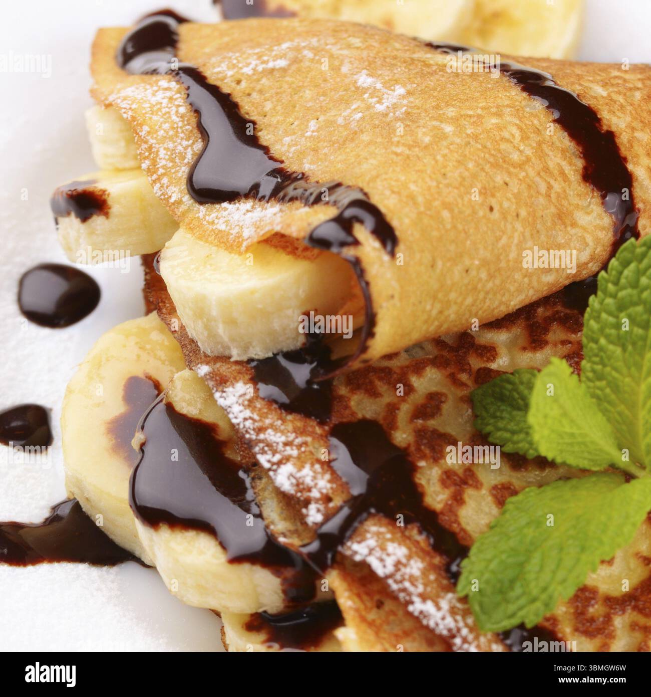 French style crepes with banana, chocolate sauce and sugar powder, Sumy ...