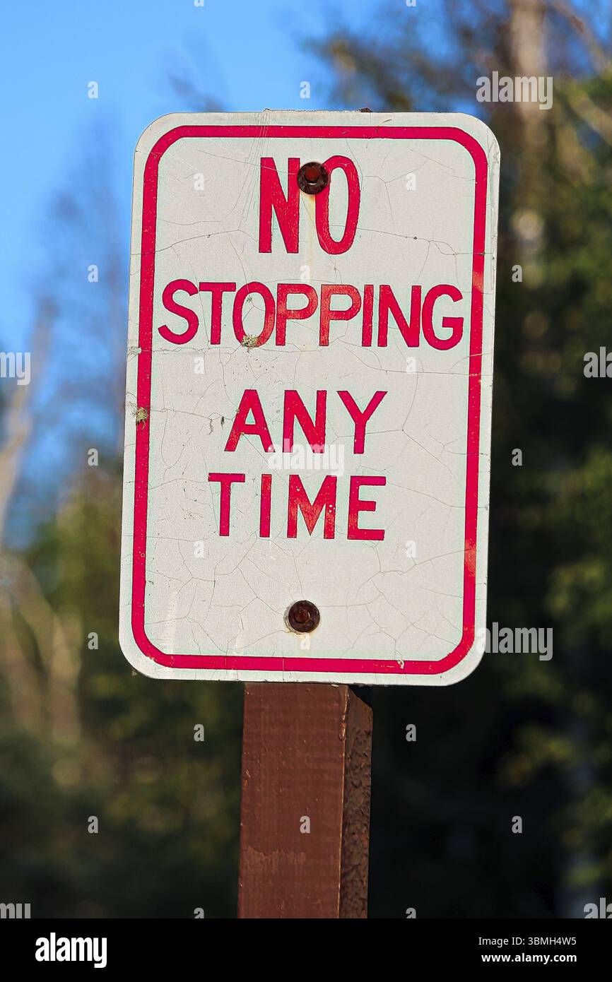 A red no stopping any time sign Stock Photo - Alamy