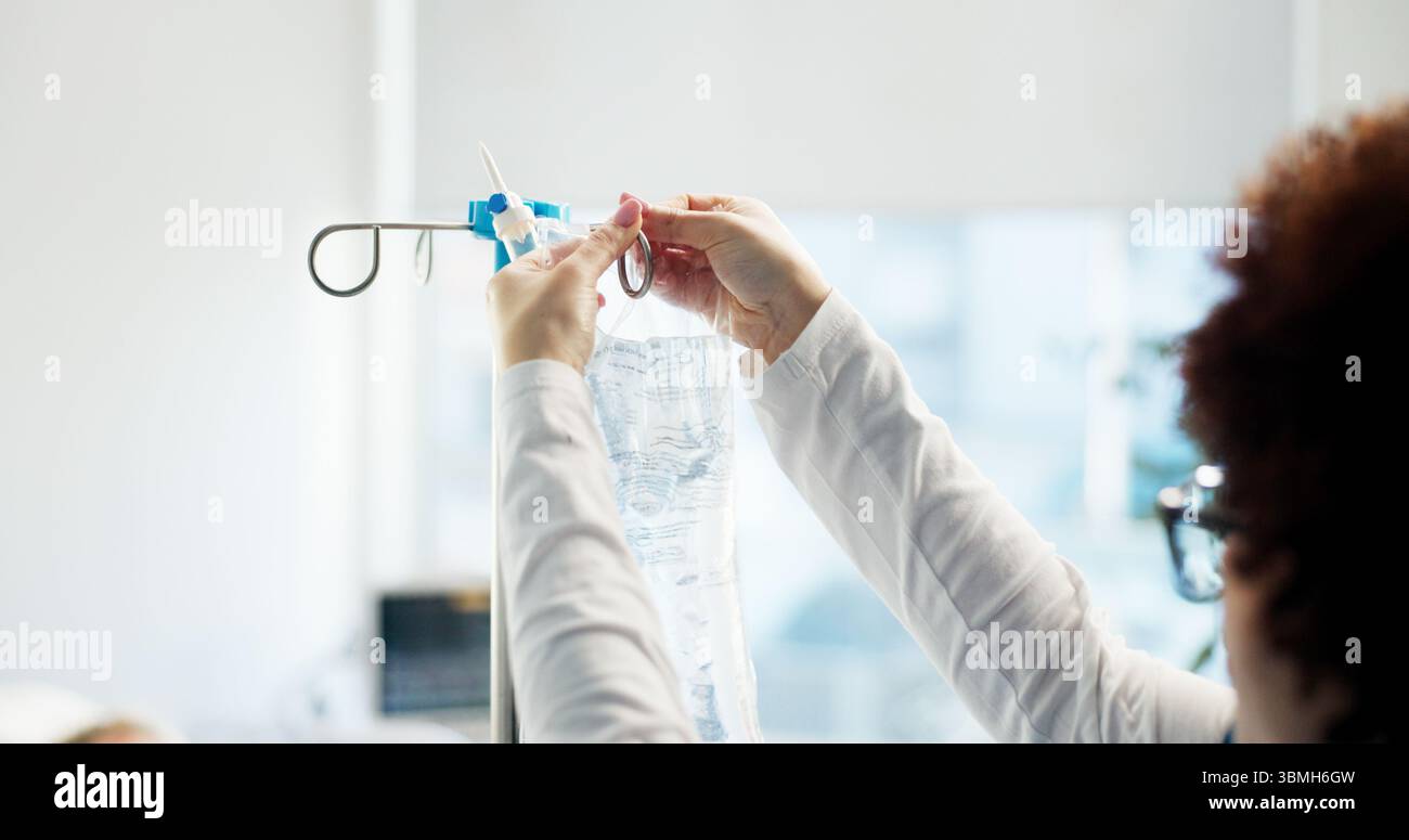 Nurse, hands and iv drip in hospital for medicine, illness treatment or ...