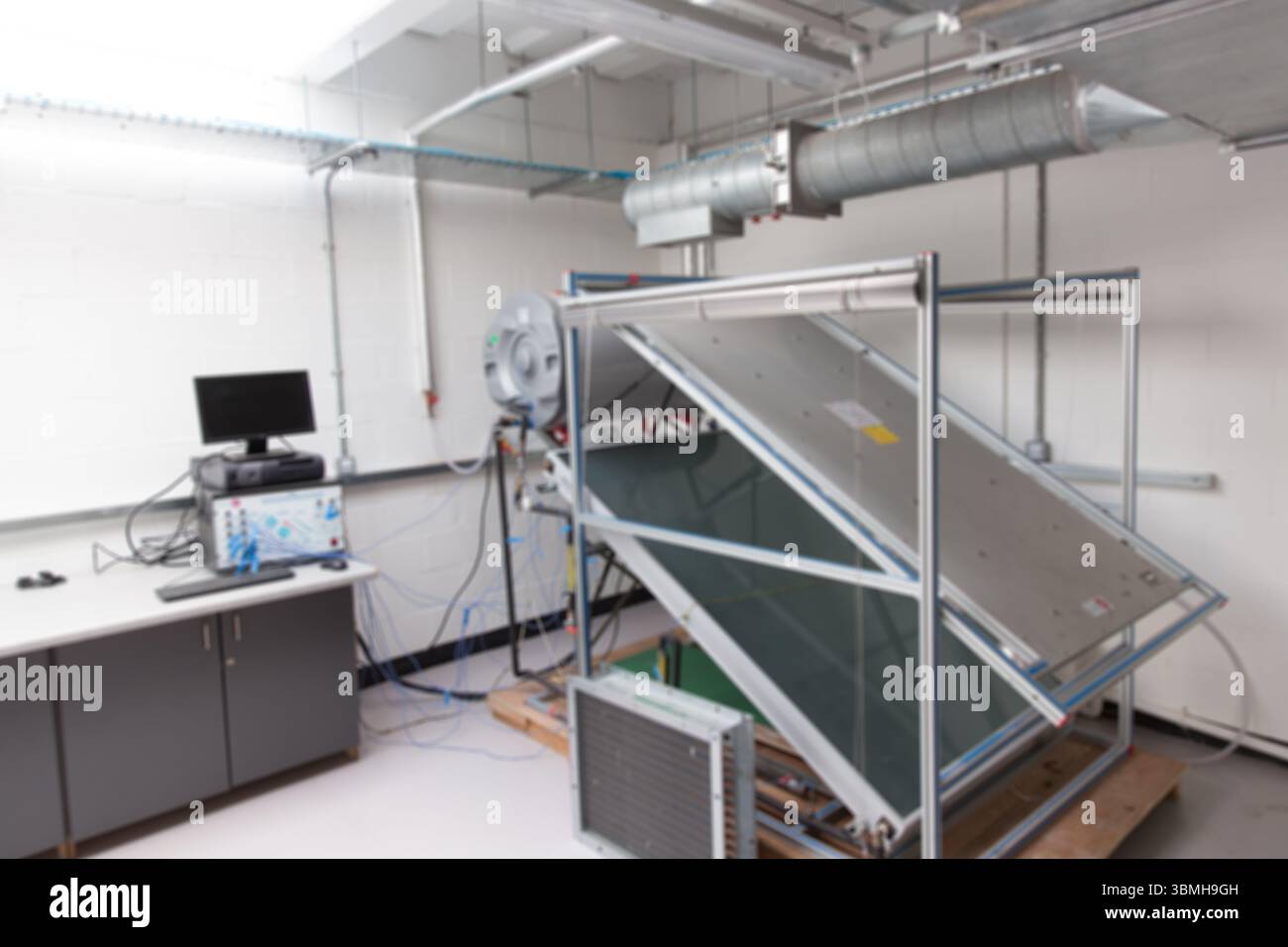 Large wheeled test apparatus is standing in flat design lab, with ...