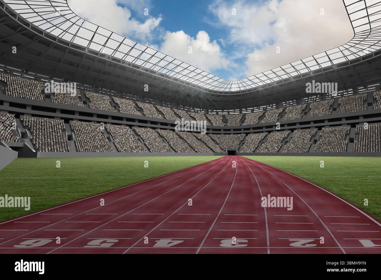 Red oval track stretching toward tunnel under stands amid grassy field ...