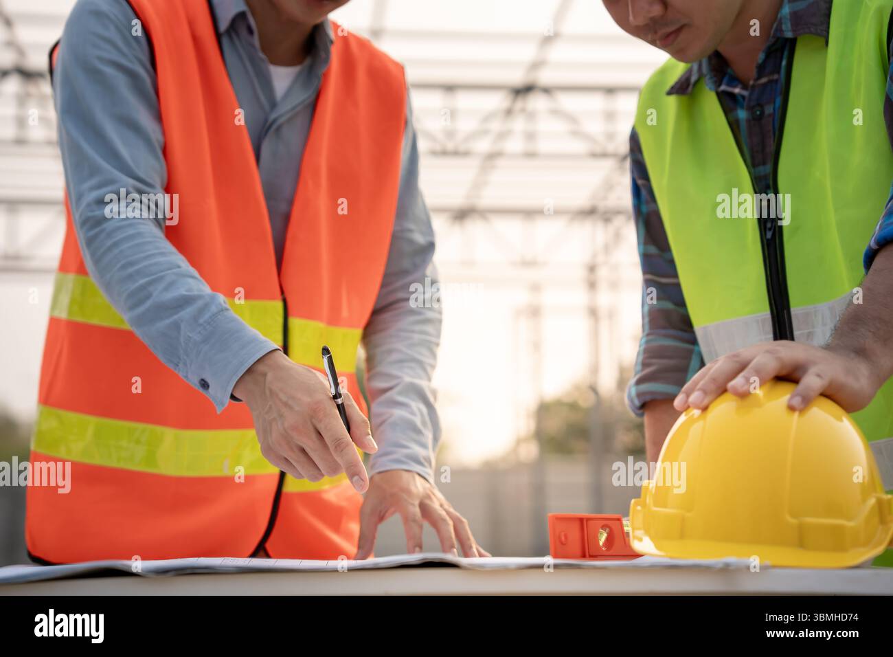 Engineers team and owner discuss check and review the blueprint of ...
