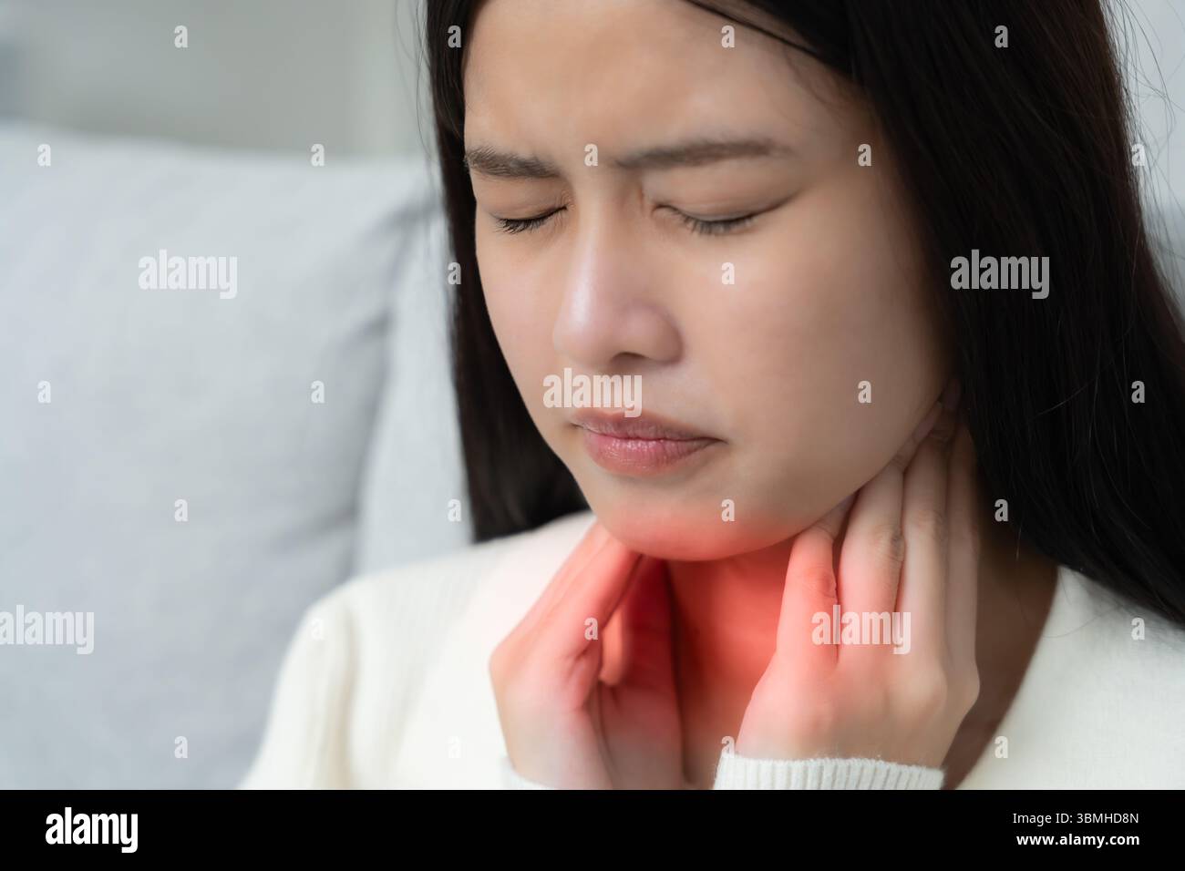 Asian woman put on neck due to a sore throat. female tonsillitis causes ...