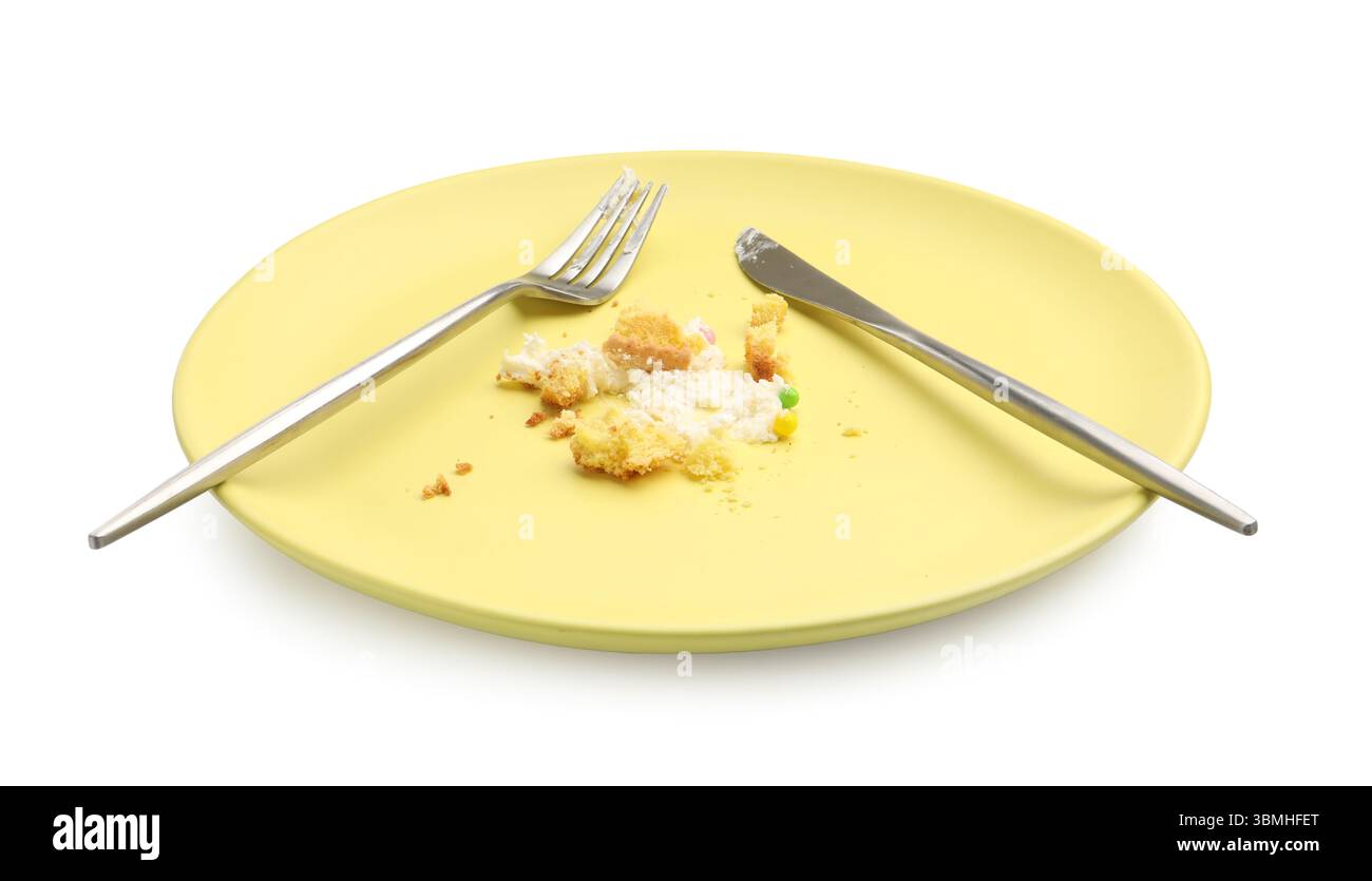 Dirty plate with crumbs, cream and cutlery isolated on white Stock ...