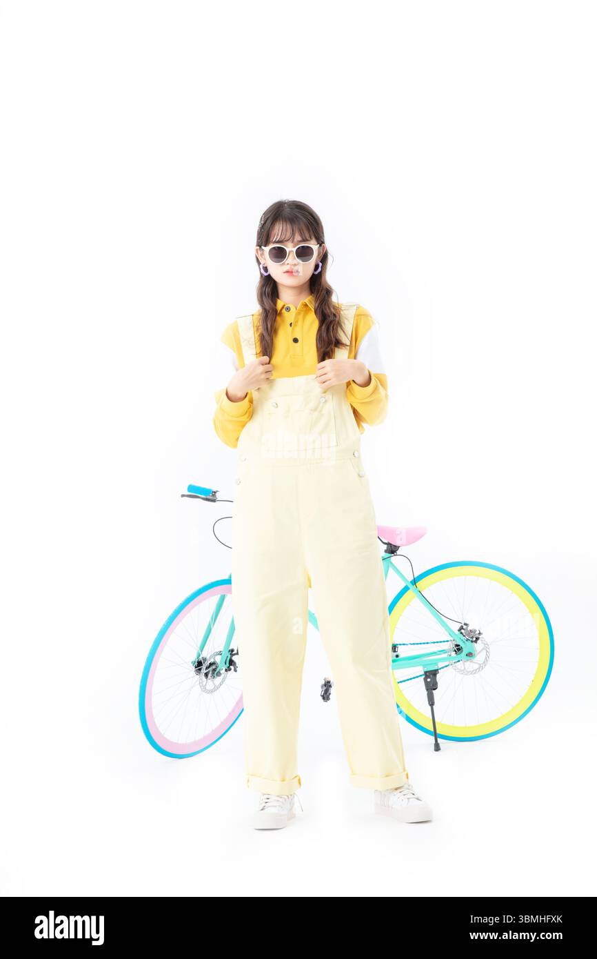 A young female college student in bib overalls Stock Photo - Alamy
