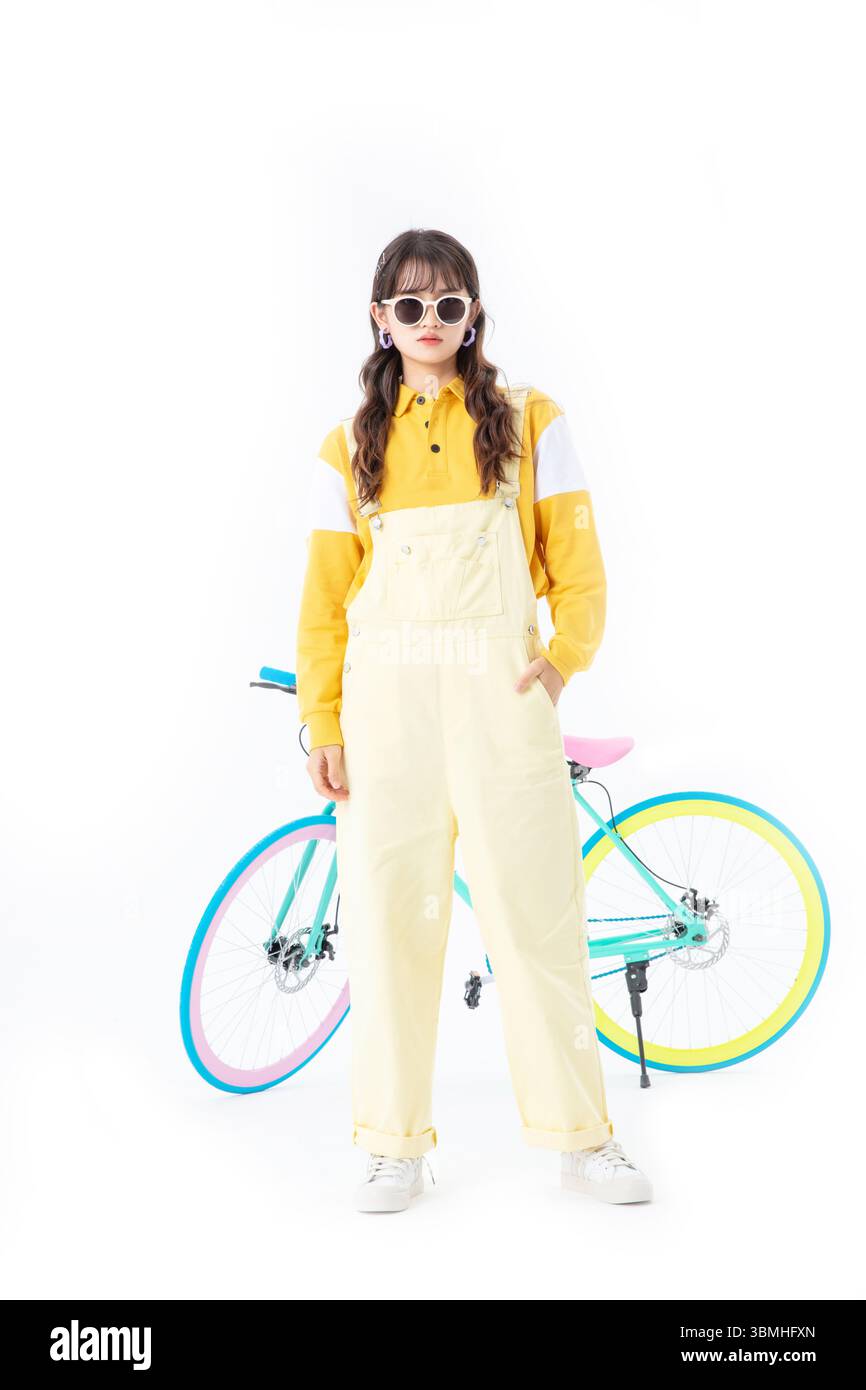 A young female college student in bib overalls Stock Photo - Alamy
