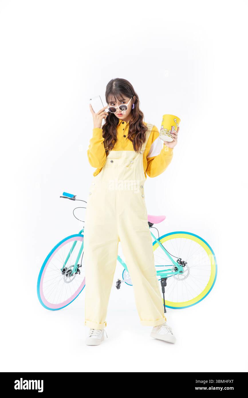 A young female college student in bib overalls Stock Photo - Alamy