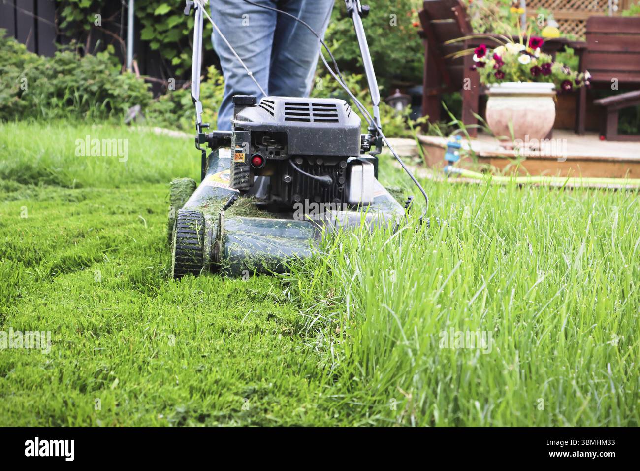 Lawn mower cutting tall hi-res stock photography and images - Alamy