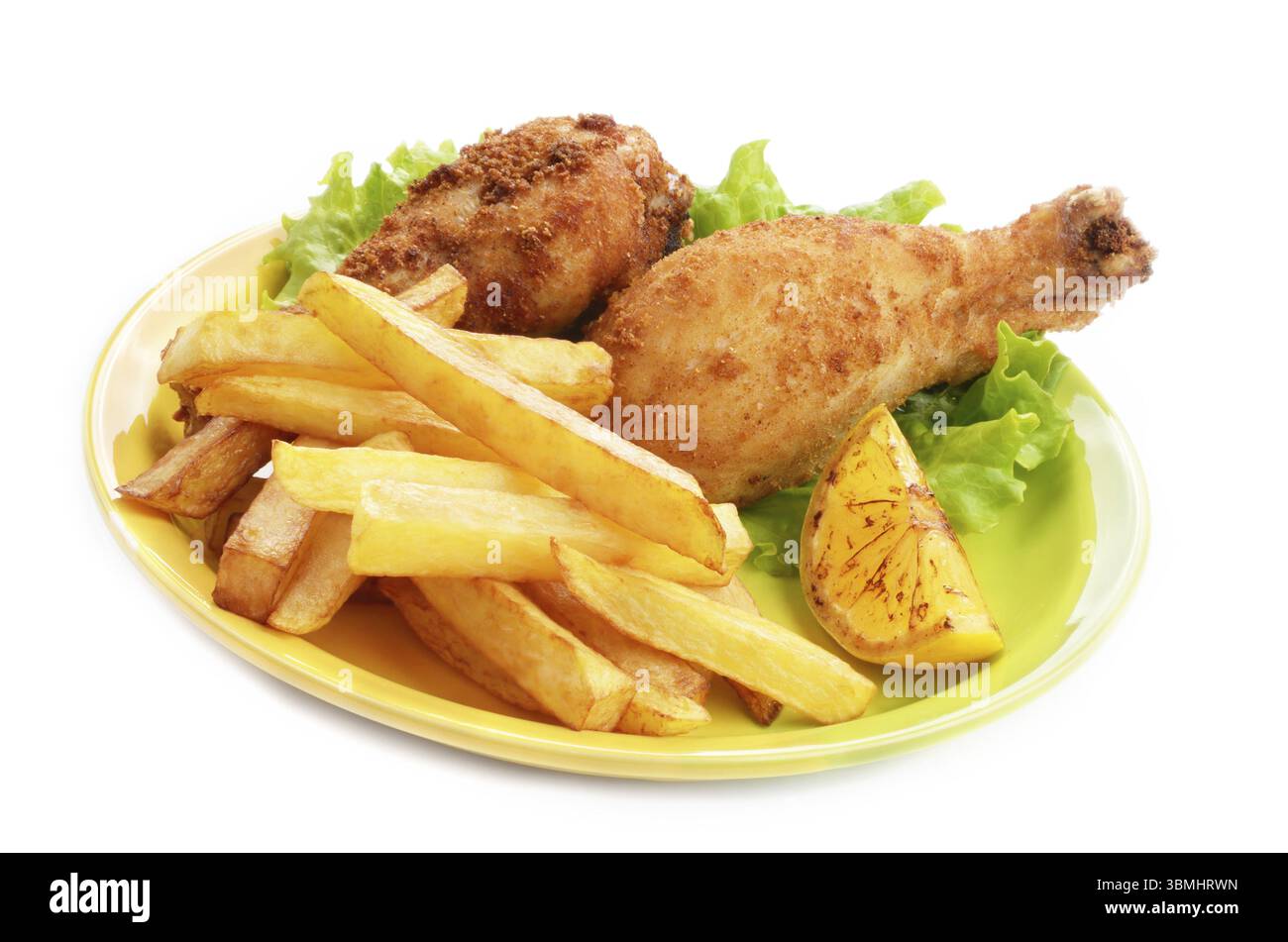 Fried drumsticks with french fries over white background, Sumy, Ukraine ...