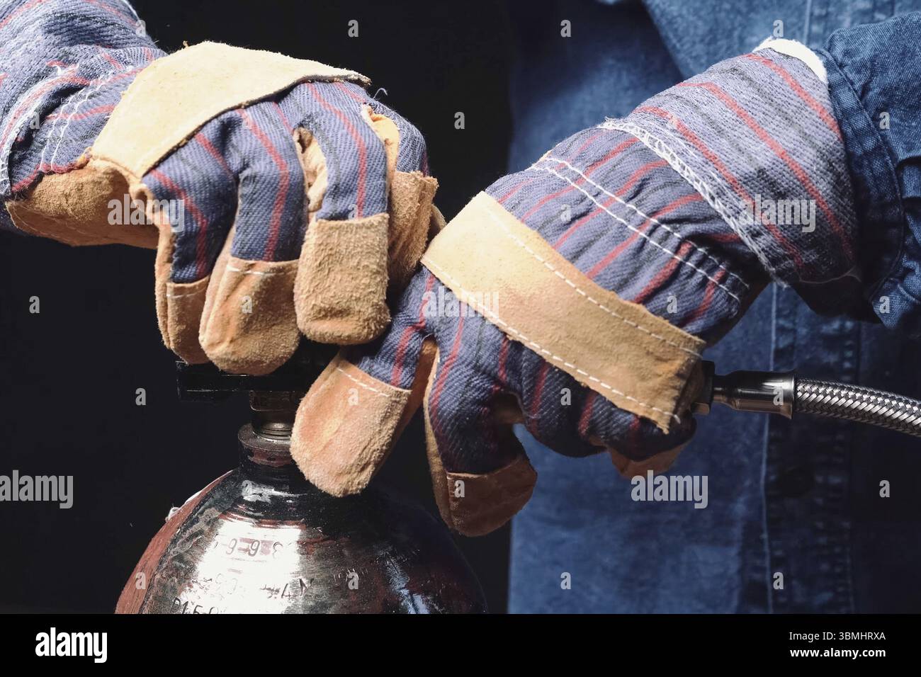Fixing the hose on the gas balloon. An airtight gas hose Stock Photo ...