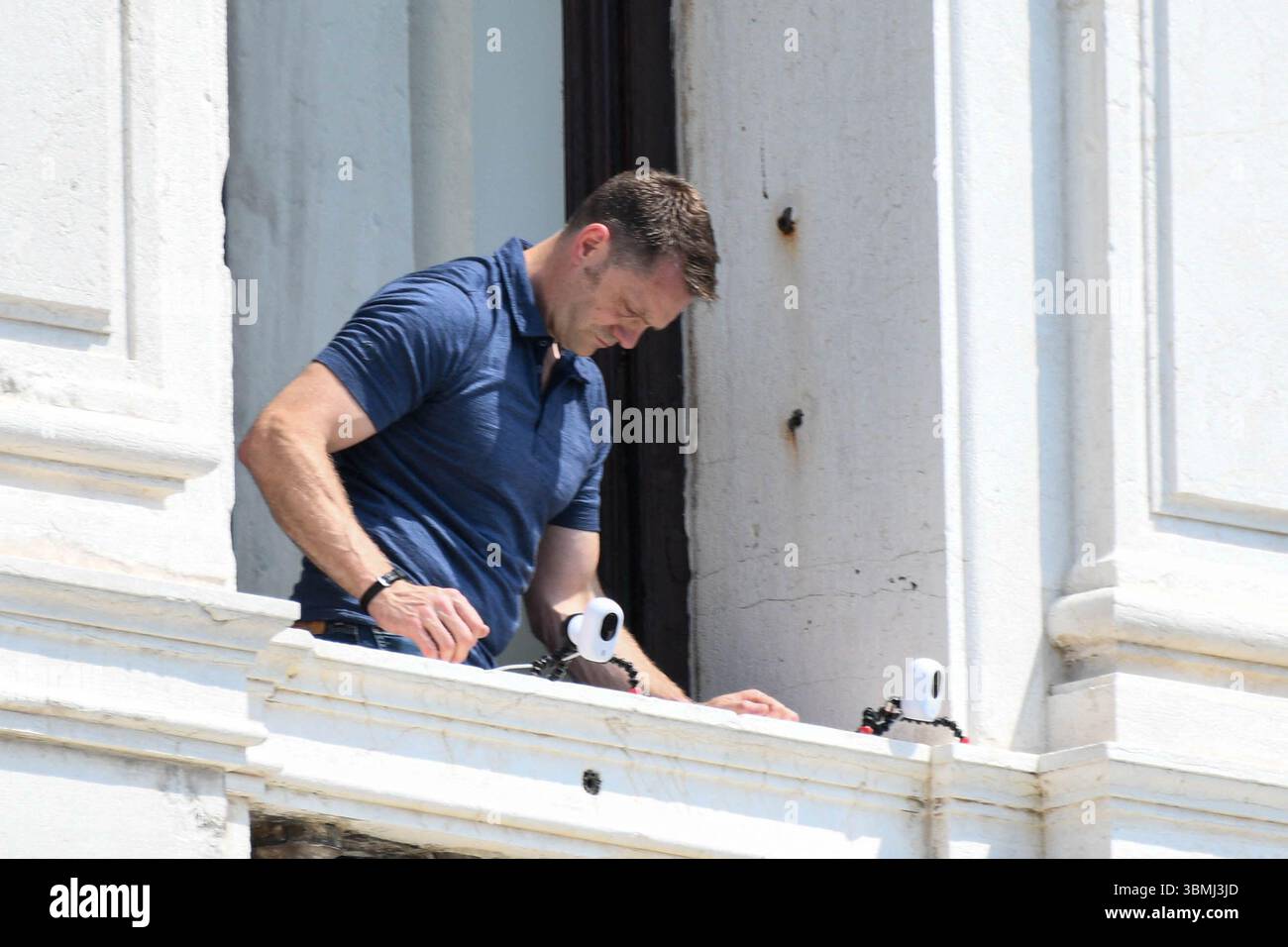 Venice, Italy. 25th June, 2025. A private security guard installs ...