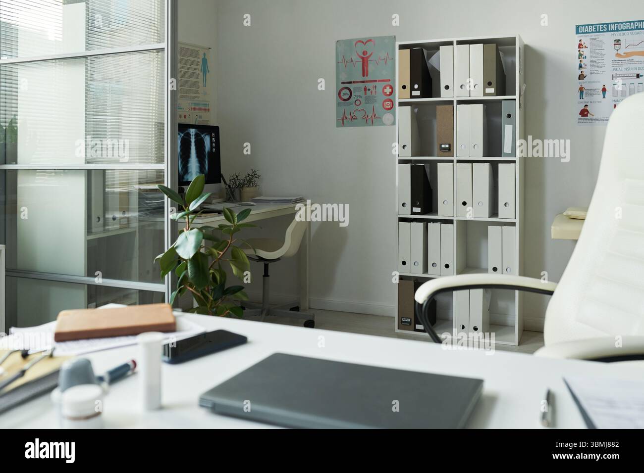 Medical office interior showing organized workspace with documents ...