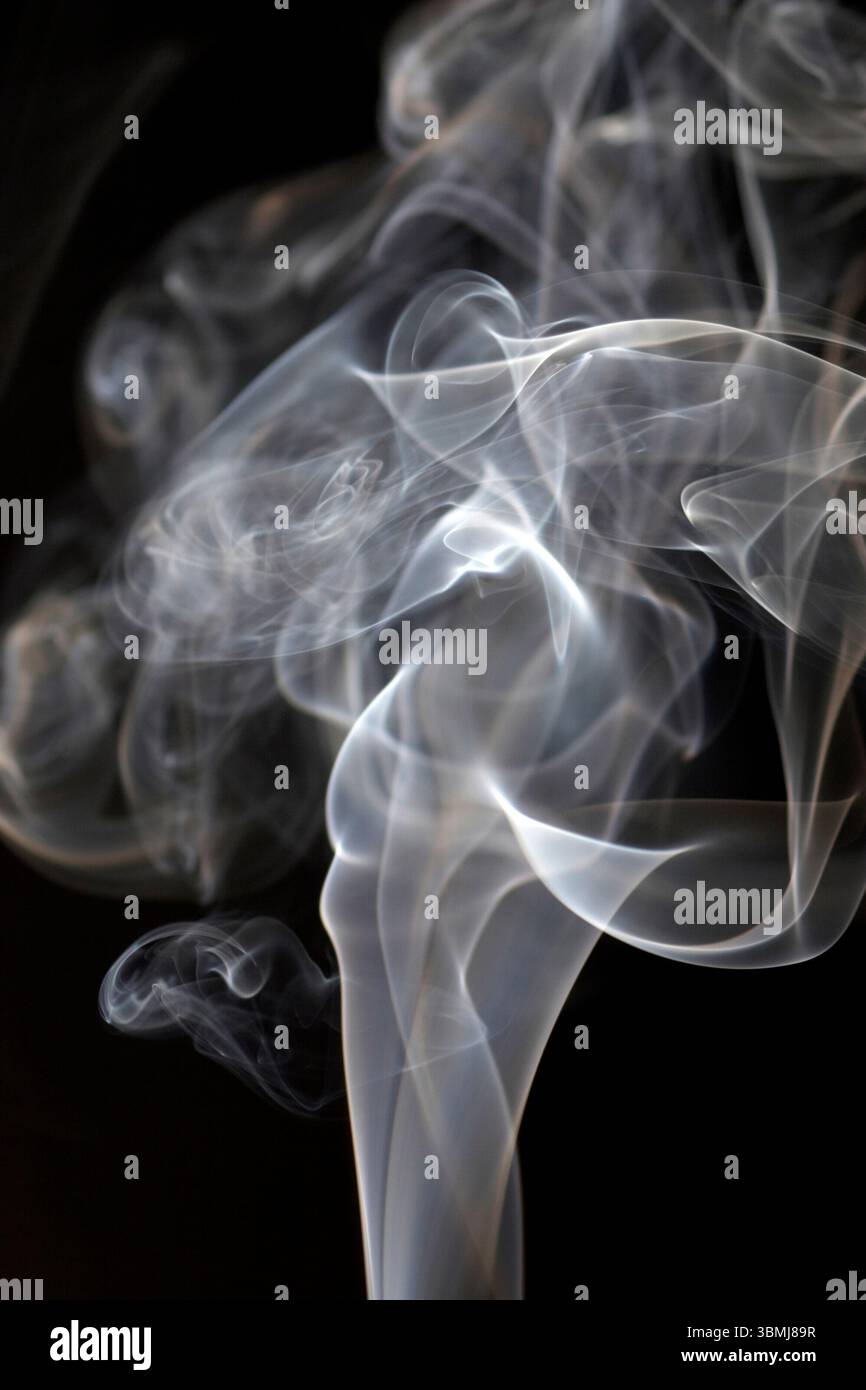 Smoke trails from a burning cigarette Stock Photo - Alamy