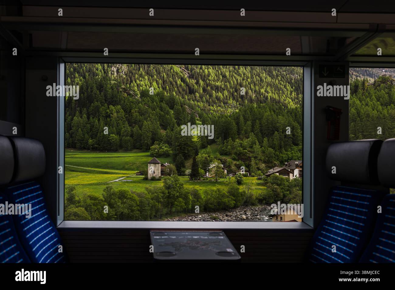 Framed view from a train window of a quiet alpine valley Stock Photo ...
