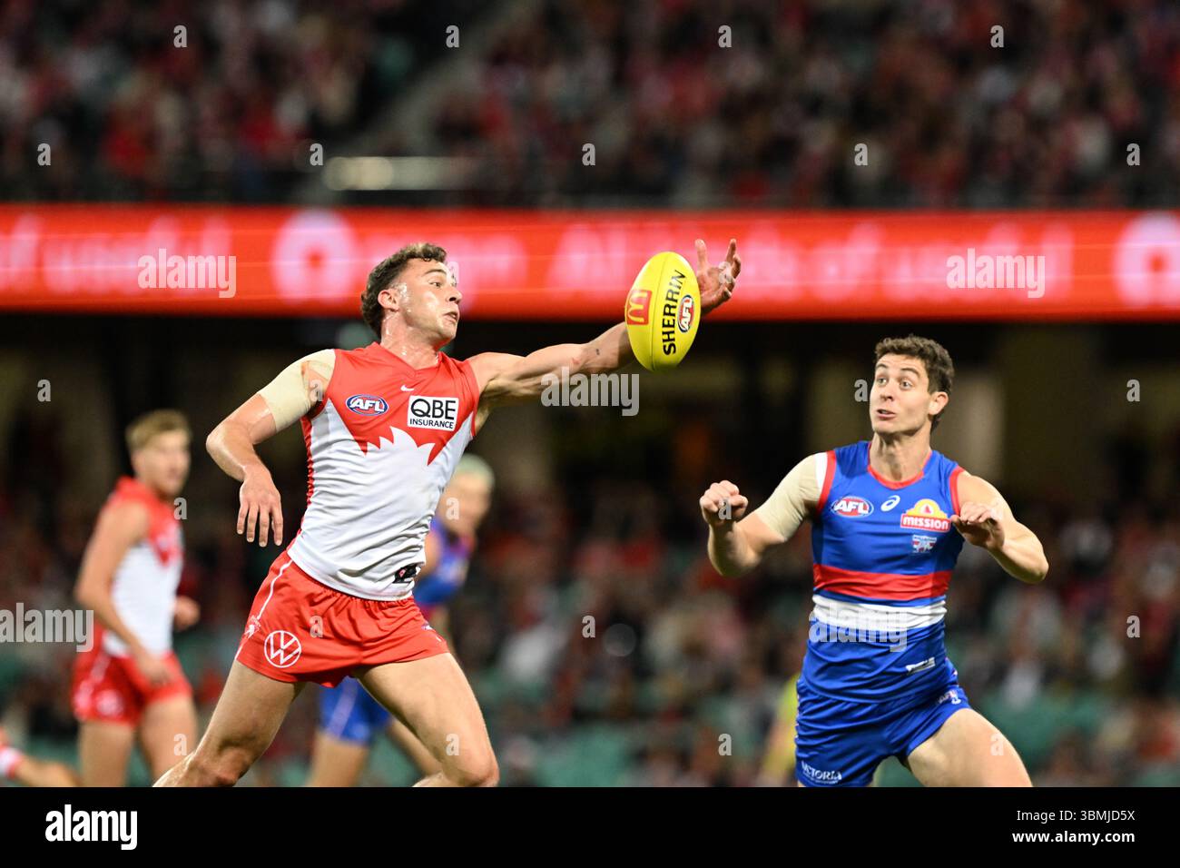 Will Hayward of the Swans and Nick Coffield of the Bulldogs during the ...