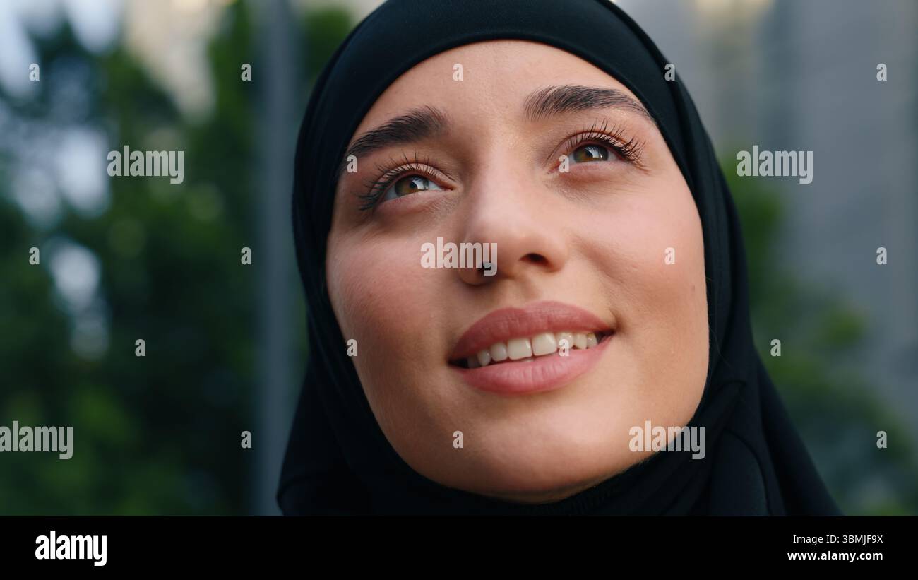 Portrait in city outdoors pensive thinking happy smiling pretty ...