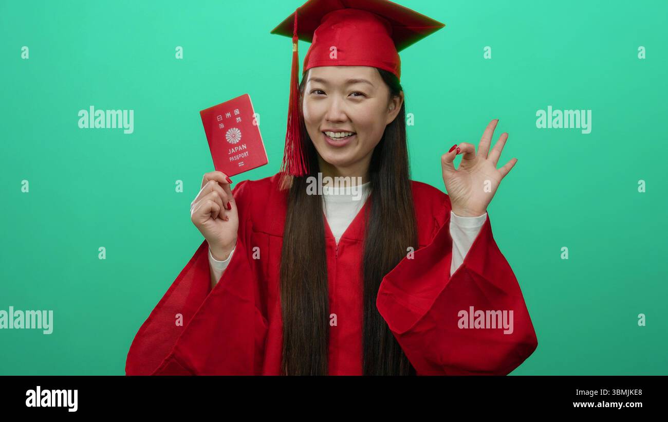 Japanese woman in red graduation gown proudly displays japan passport ...