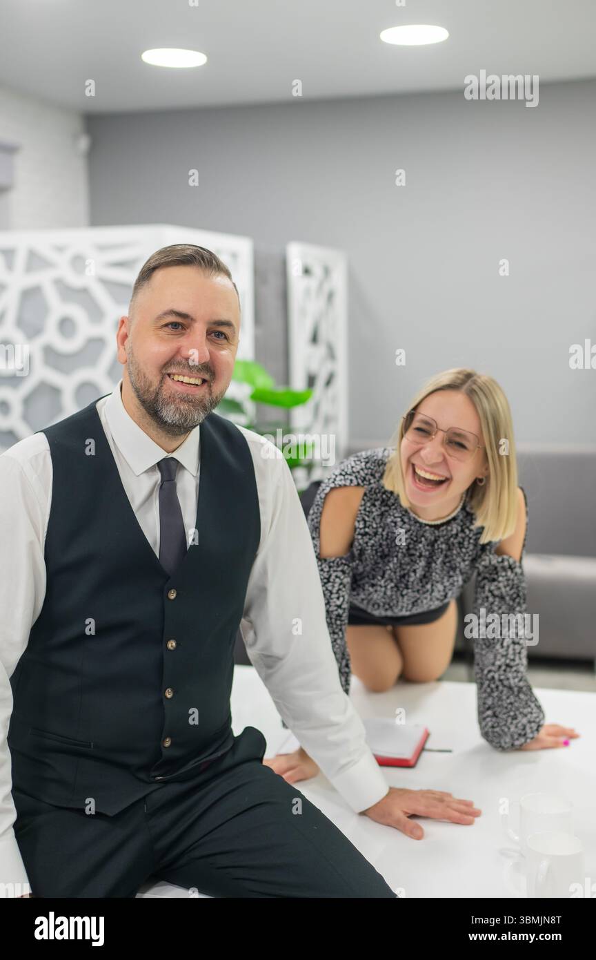 Colleagues fooling around at work in the office Stock Photo - Alamy