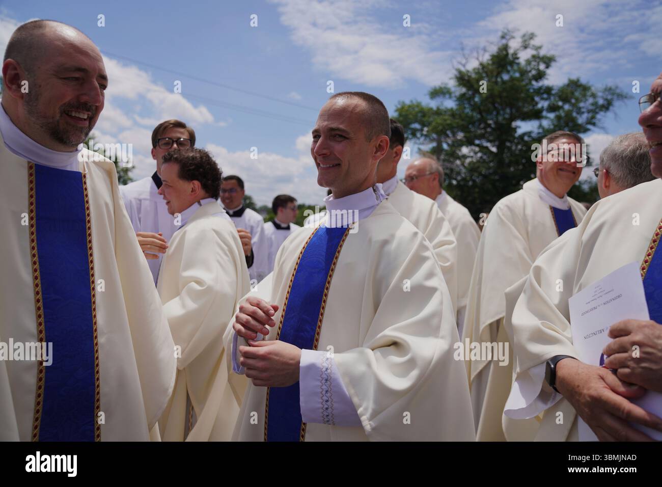 The Revs. Andrew Lewandowski, left, and Mike Sampson, center, stand ...