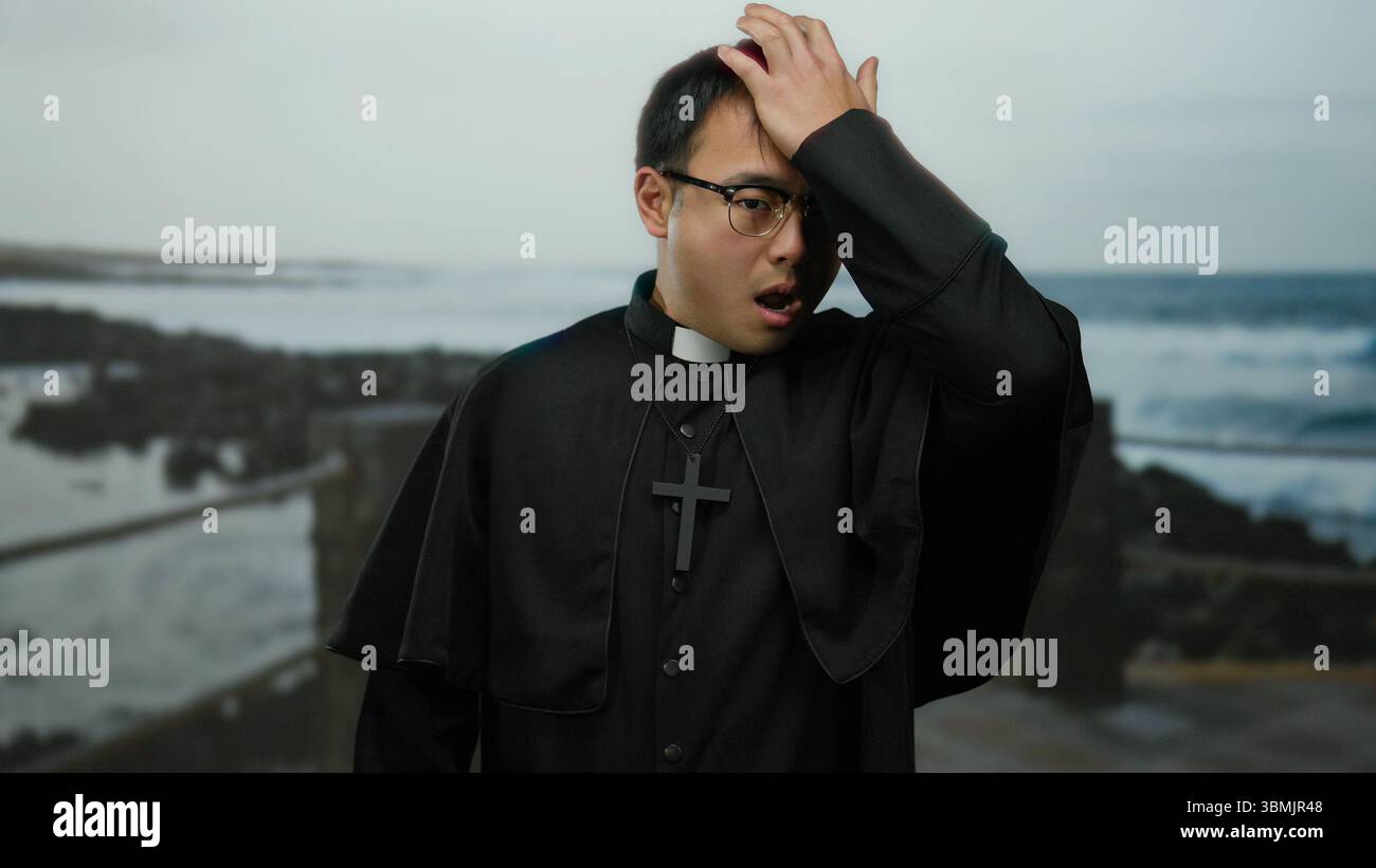 Man in priest attire stands hi-res stock photography and images - Alamy