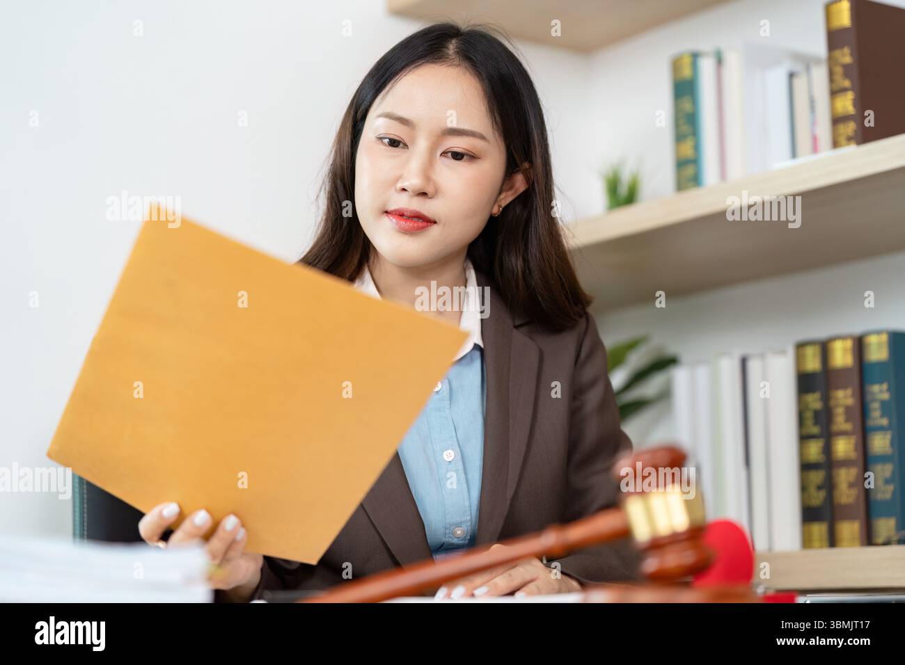Legal Professional Reviewing Case Documents. A lawyer analyzing ...