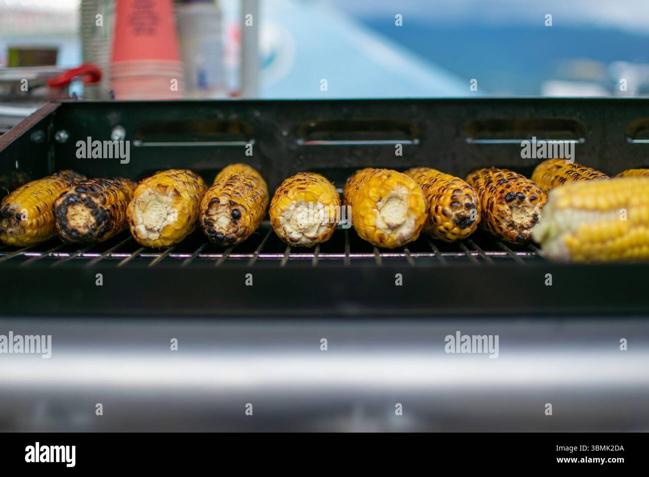 Chargrilled Corn on the Cob over Open Flame Stock Photo - Alamy
