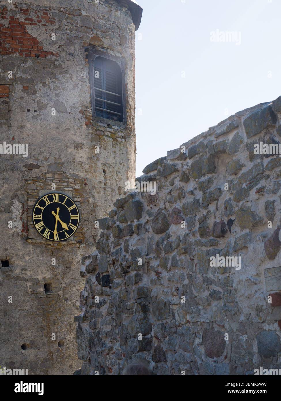 Stone clock tower of medieval castle ruins in Estonia. Historical ...