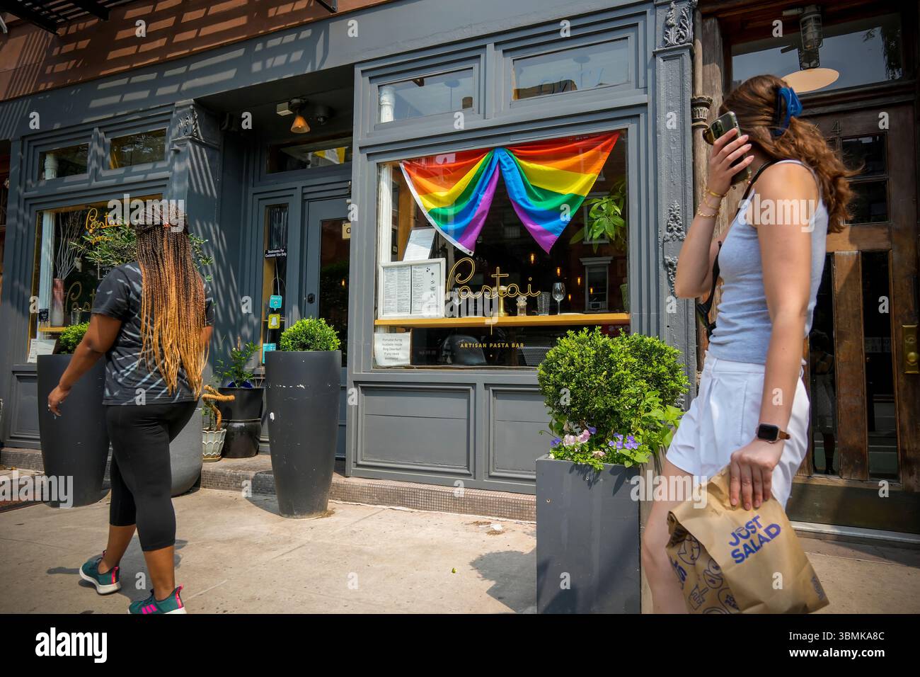 Pastai restaurant in Chelsea in New York displays rainbow pride bunting ...