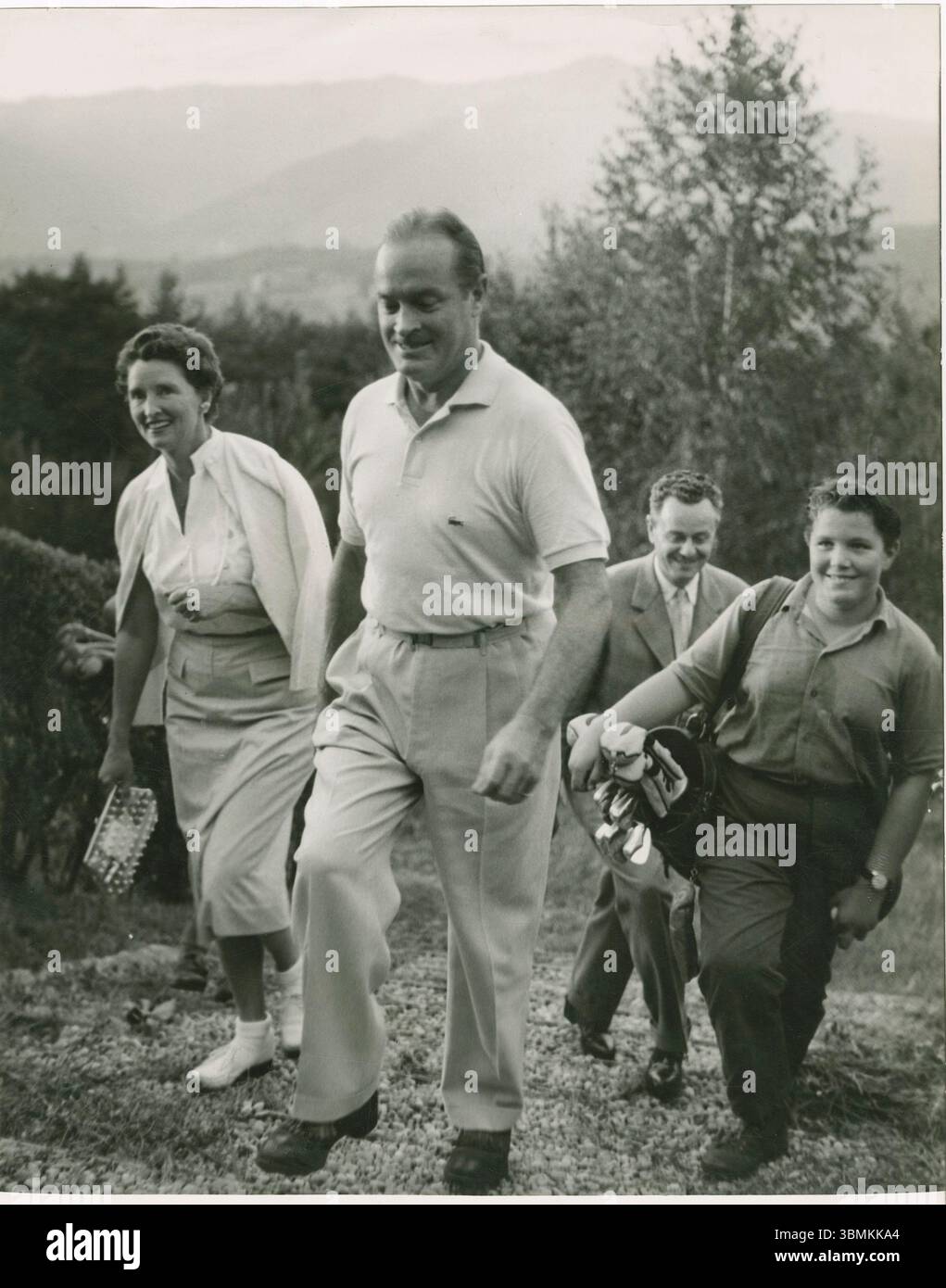 Portrait of American actor Bob Hope with other people during a period ...