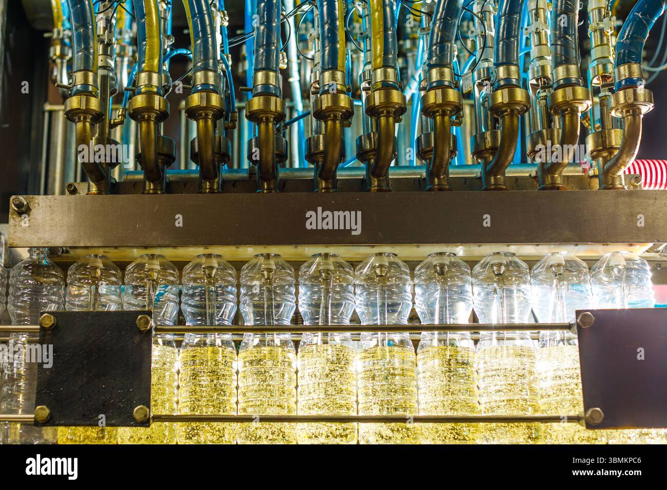 Automated sunflower oil filling line with transparent bottles and ...