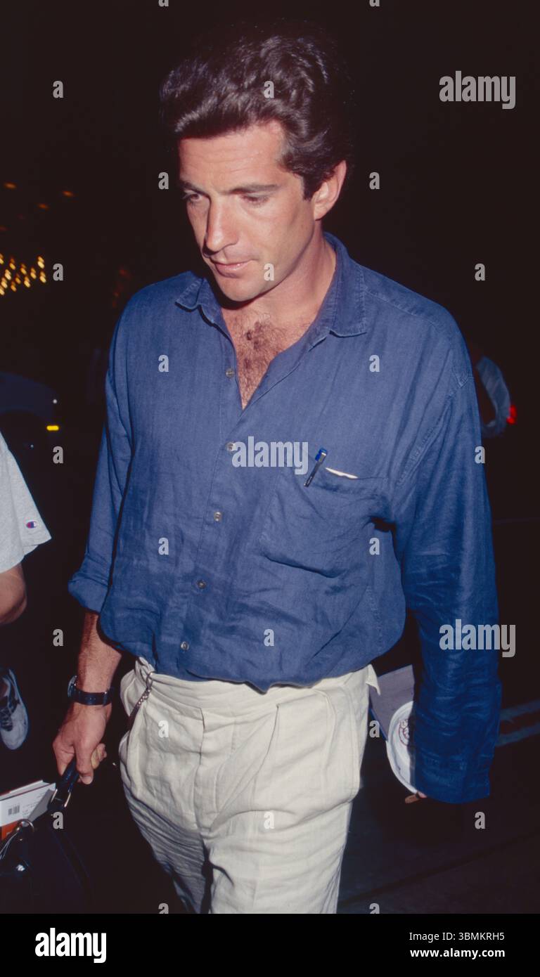 John Kennedy Jr. leaving George Magazine office and picking up his ...