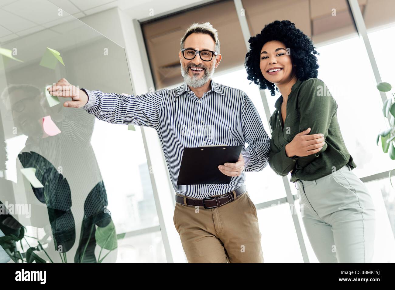 Diverse coworkers collaborating in a professional office setting ...