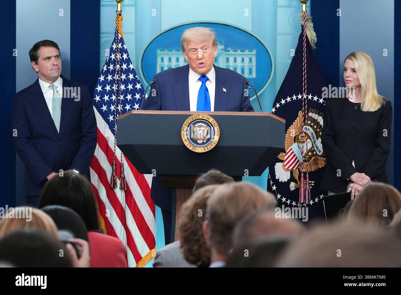 President Donald Trump speaks to the media as Attorney General Pam ...