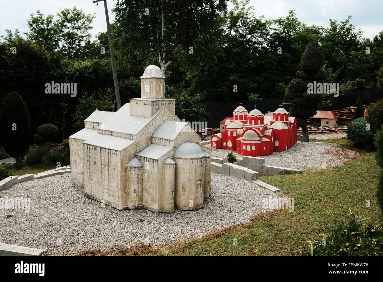Scale models of Serbian Orthodox churches in a lush garden setting ...