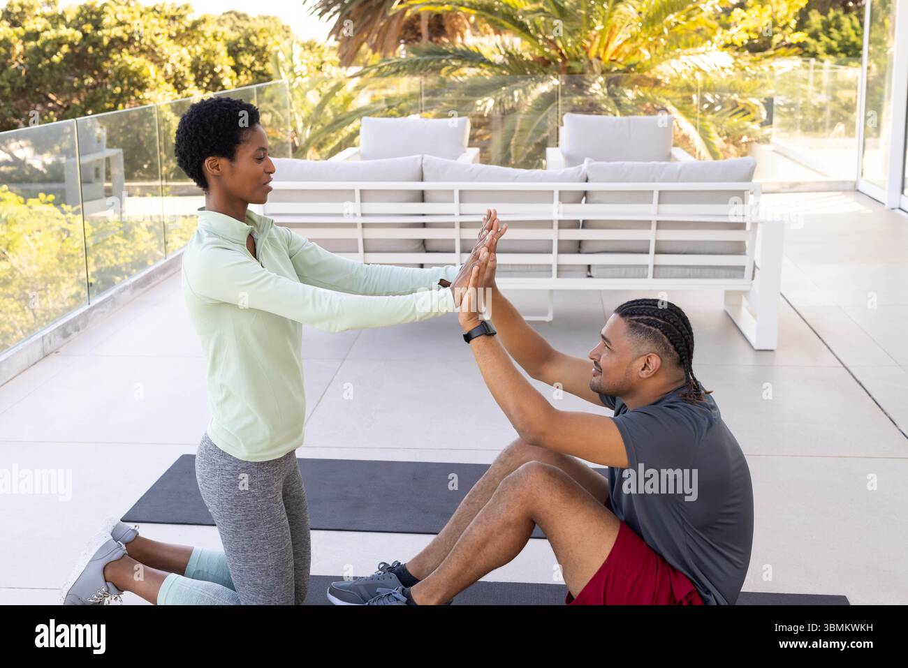 Diverse training partners kneeling hi-res stock photography and images - Alamy