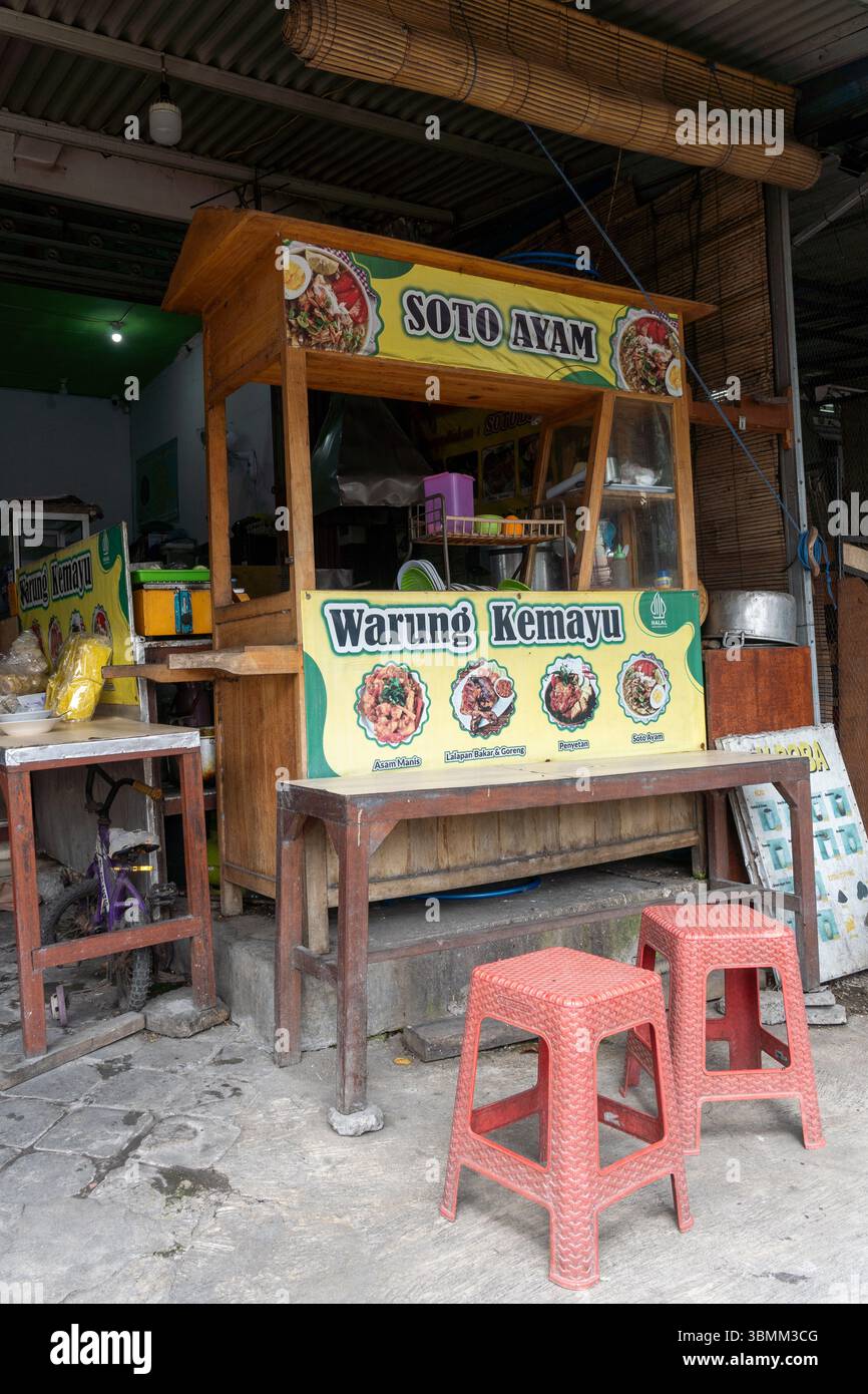 Bali, Indonesia - Dec 29, 2024: Food stand with a yellow sign that says ...