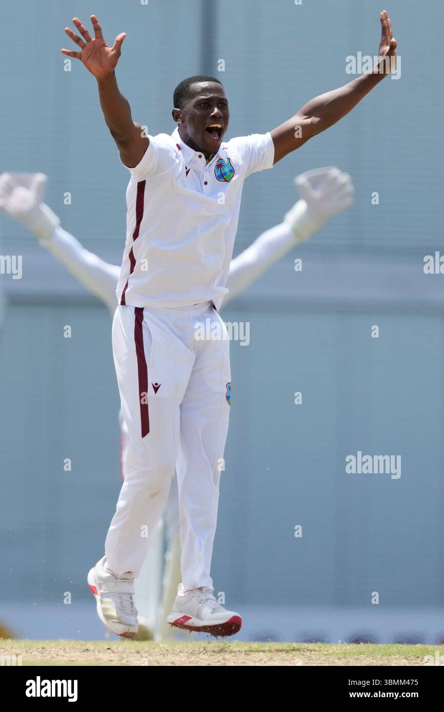 West Indies' Shamar Joseph reacts while bowling to Australia's Beau ...