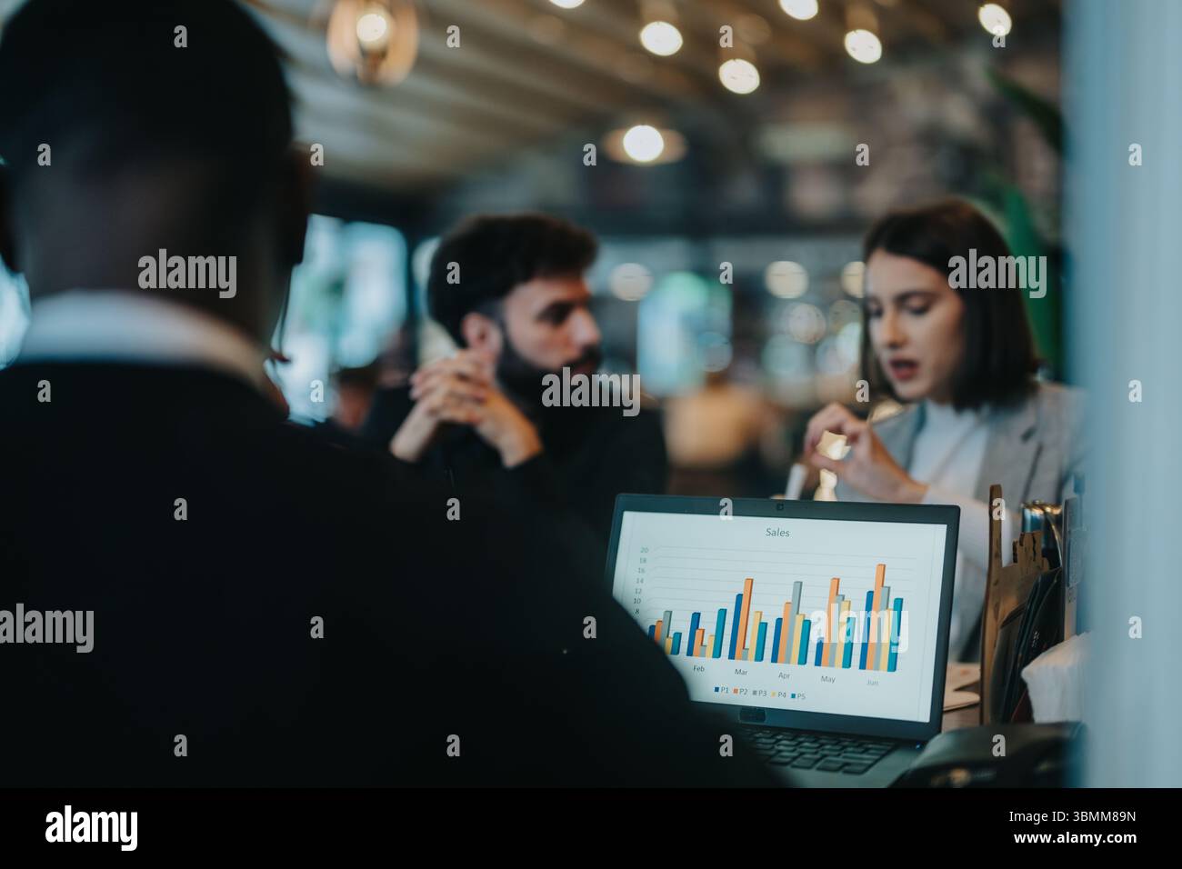 Team brainstorming session with charts at a modern workplace Stock ...