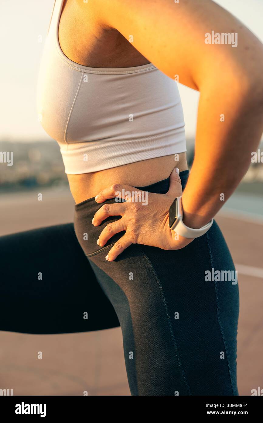 Side view close-up of a fit woman performing a lunge. Focus on proper ...