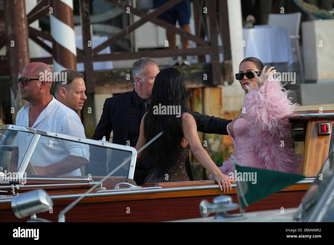 Khloe Kardashian, right, leaves a hotel ahead of the anticipated ...