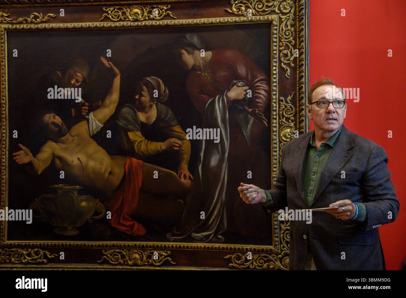 Actor Kevin Spacey gives a reading in front of works depicting St ...