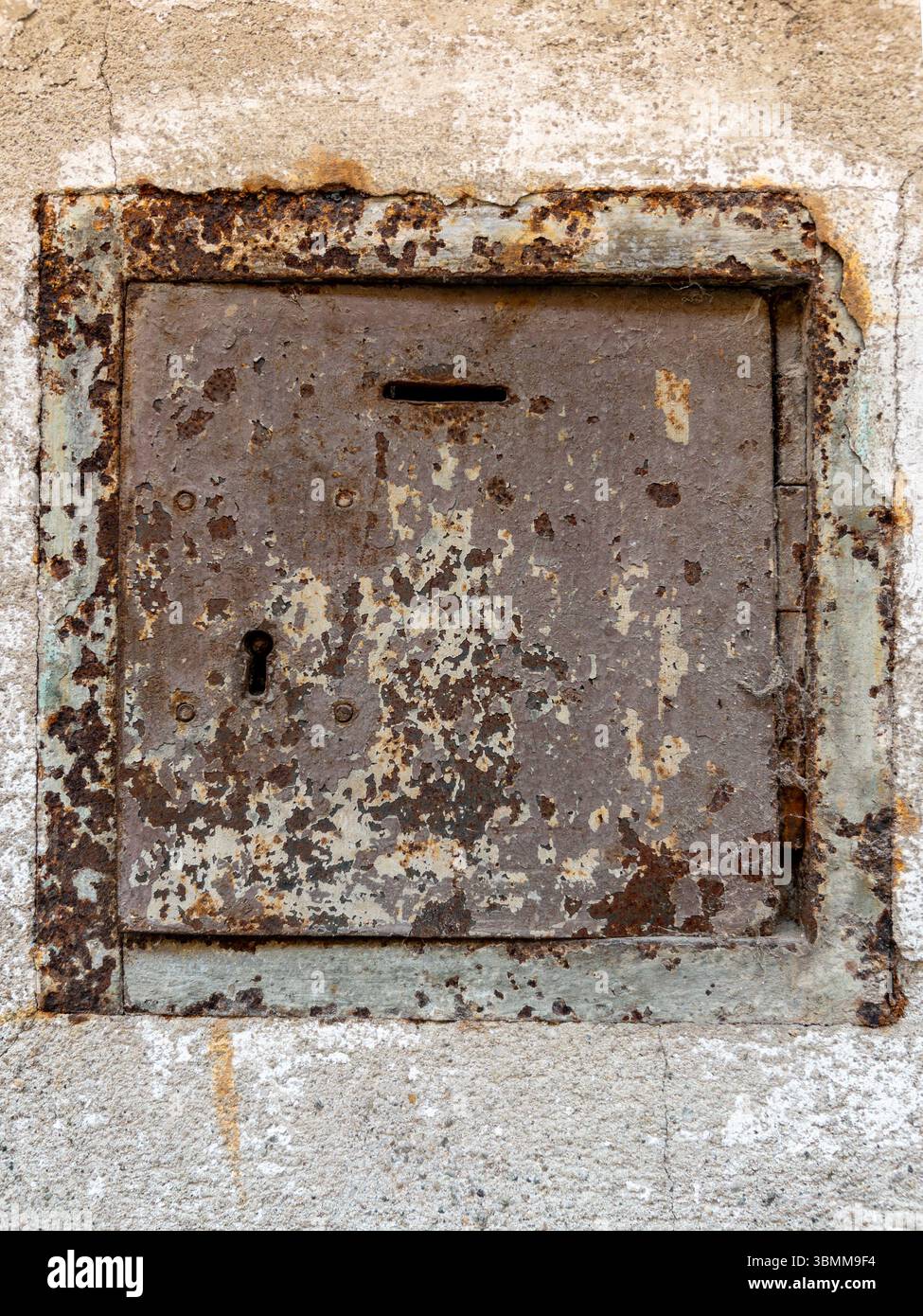Old rusty alms box on wall with peeling plaster, copy space Stock Photo ...