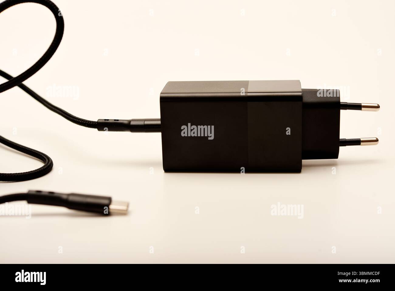 A new charger for gadgets with a wire. USB charging with a wire Stock ...