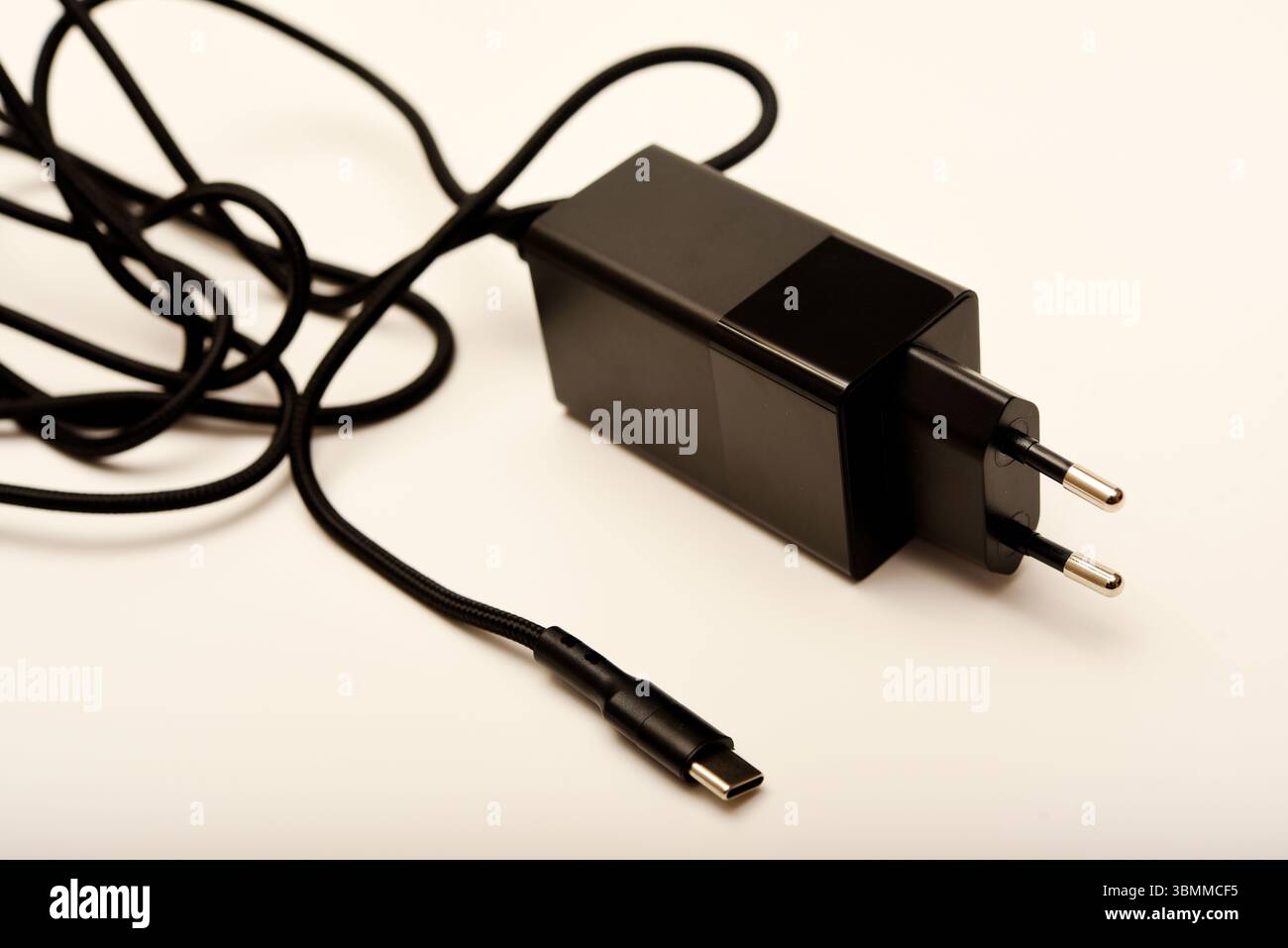 A new charger for gadgets with a wire. USB charging with a wire Stock ...