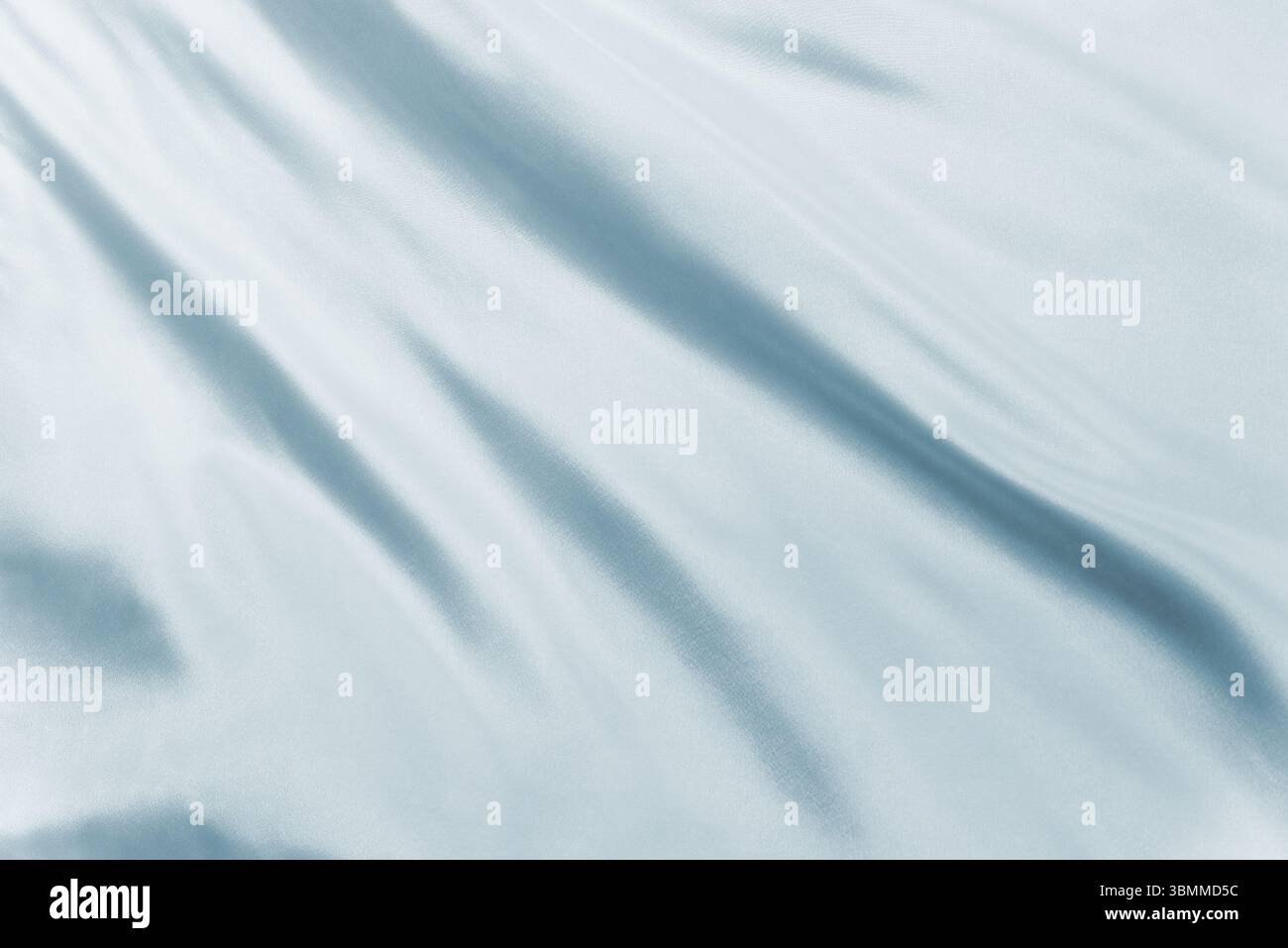 Soft white silk waving in natural light, ideal for elegant textures ...