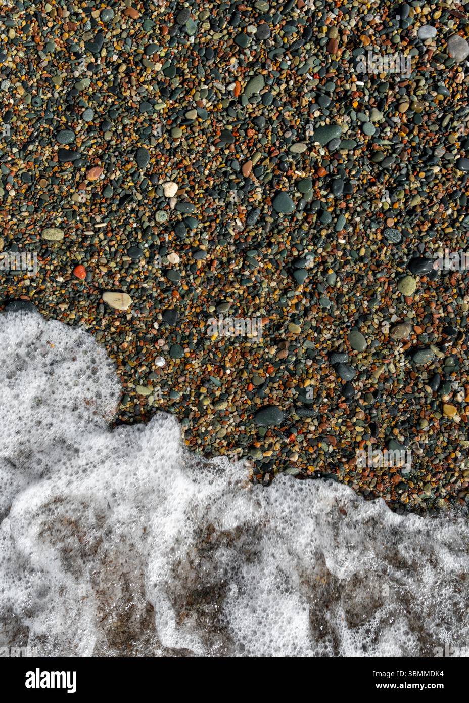 Wave rolling onto pebble hi-res stock photography and images - Alamy